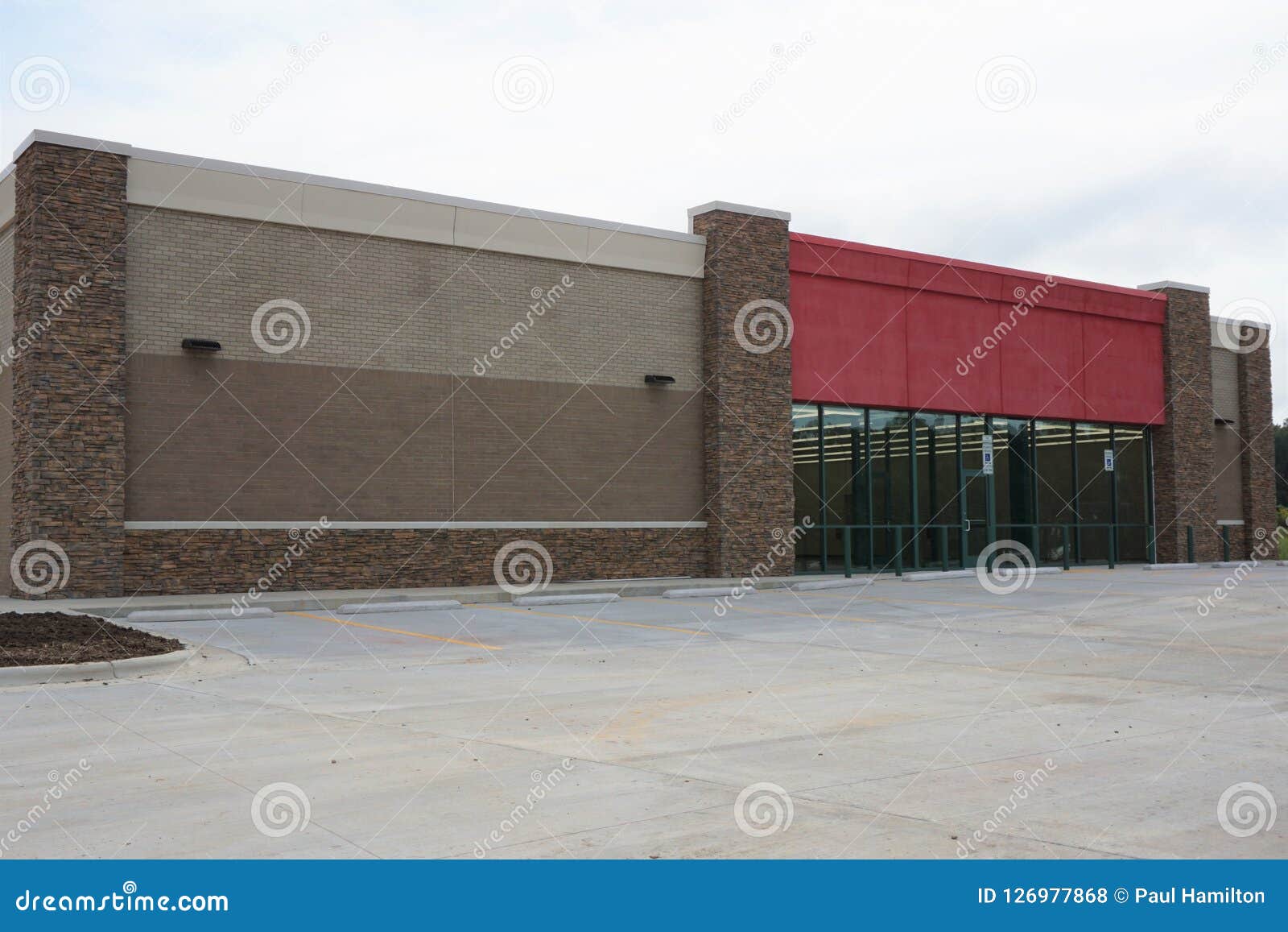 New Construction Store Front with Blank Signage Stock Photo - Image of ...