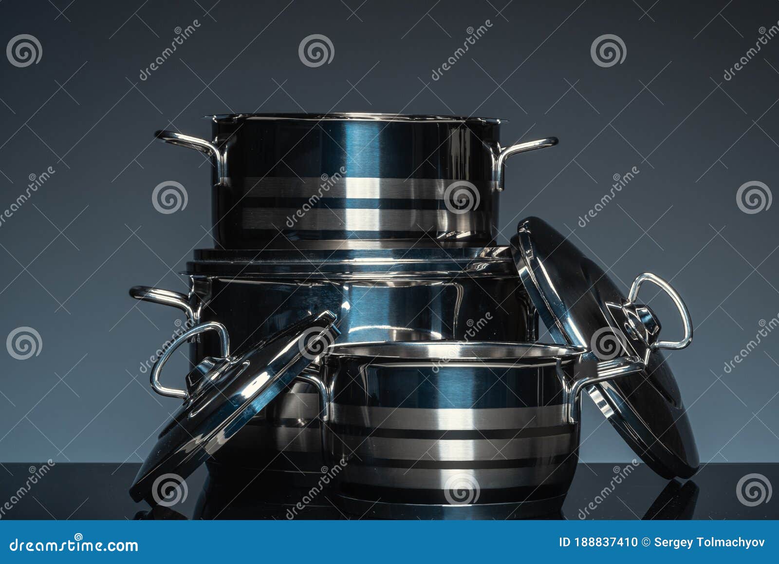 New Cookware on Black Background, Front View Stock Photo - Image of ...