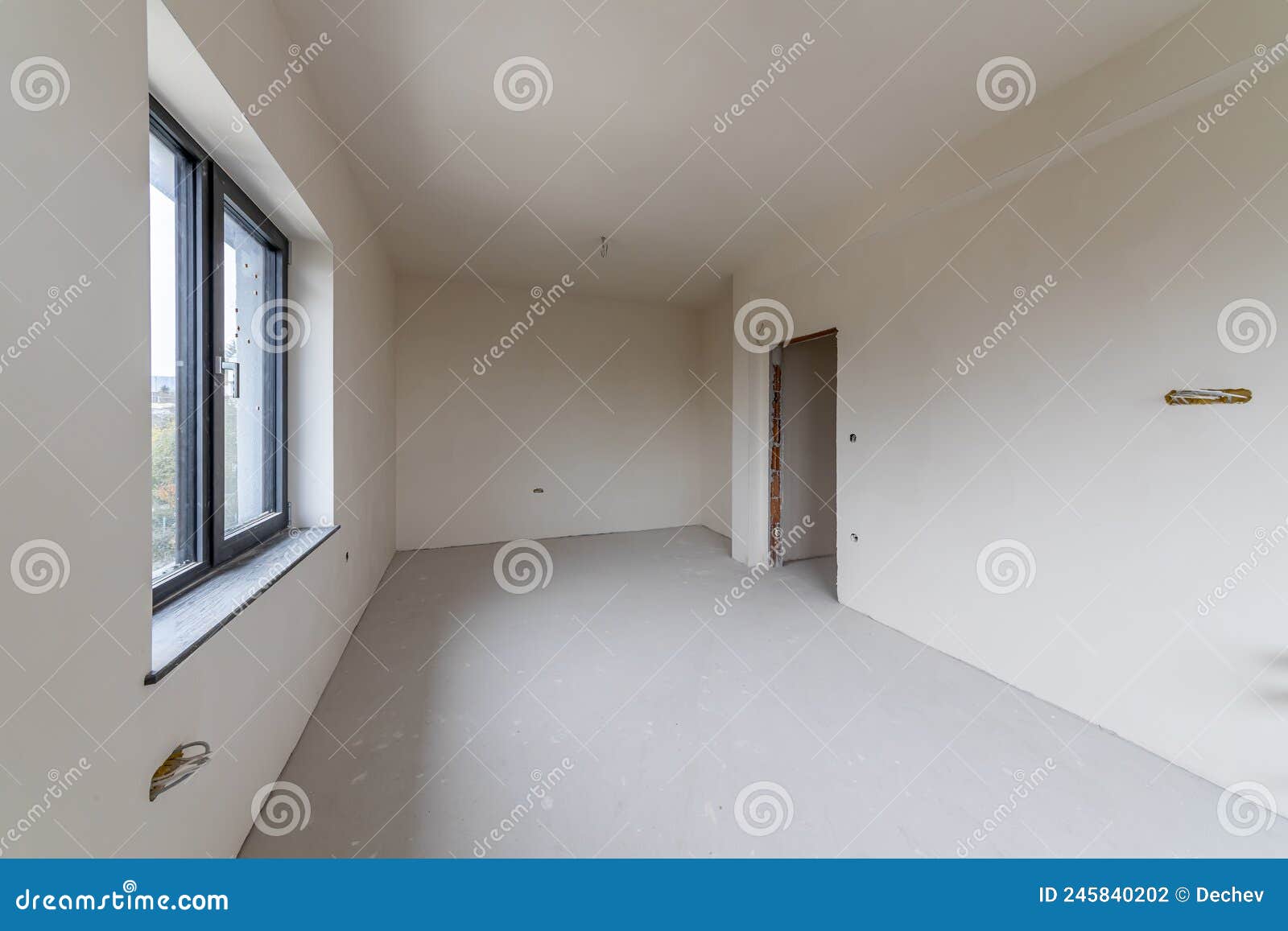 New Empty Room Under Construction. Plaster Walls. New Home. Concrete ...