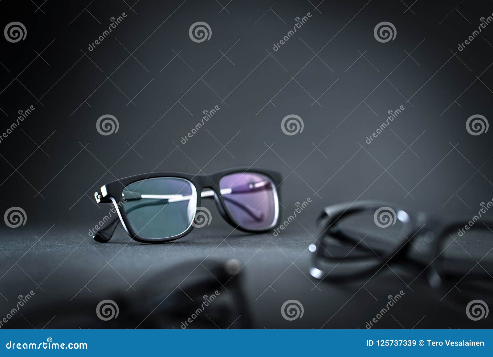 New Eyeglasses and Different Specs on Table. Stock Image - Image of ...