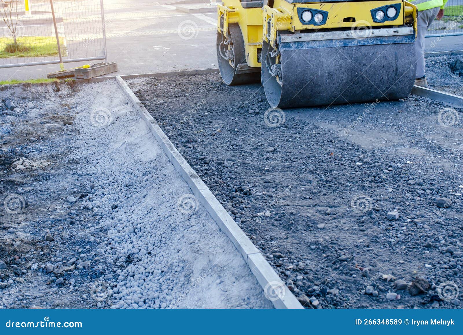 A New Footpath is Under Construction As Builders Bring Stone, Levelling ...