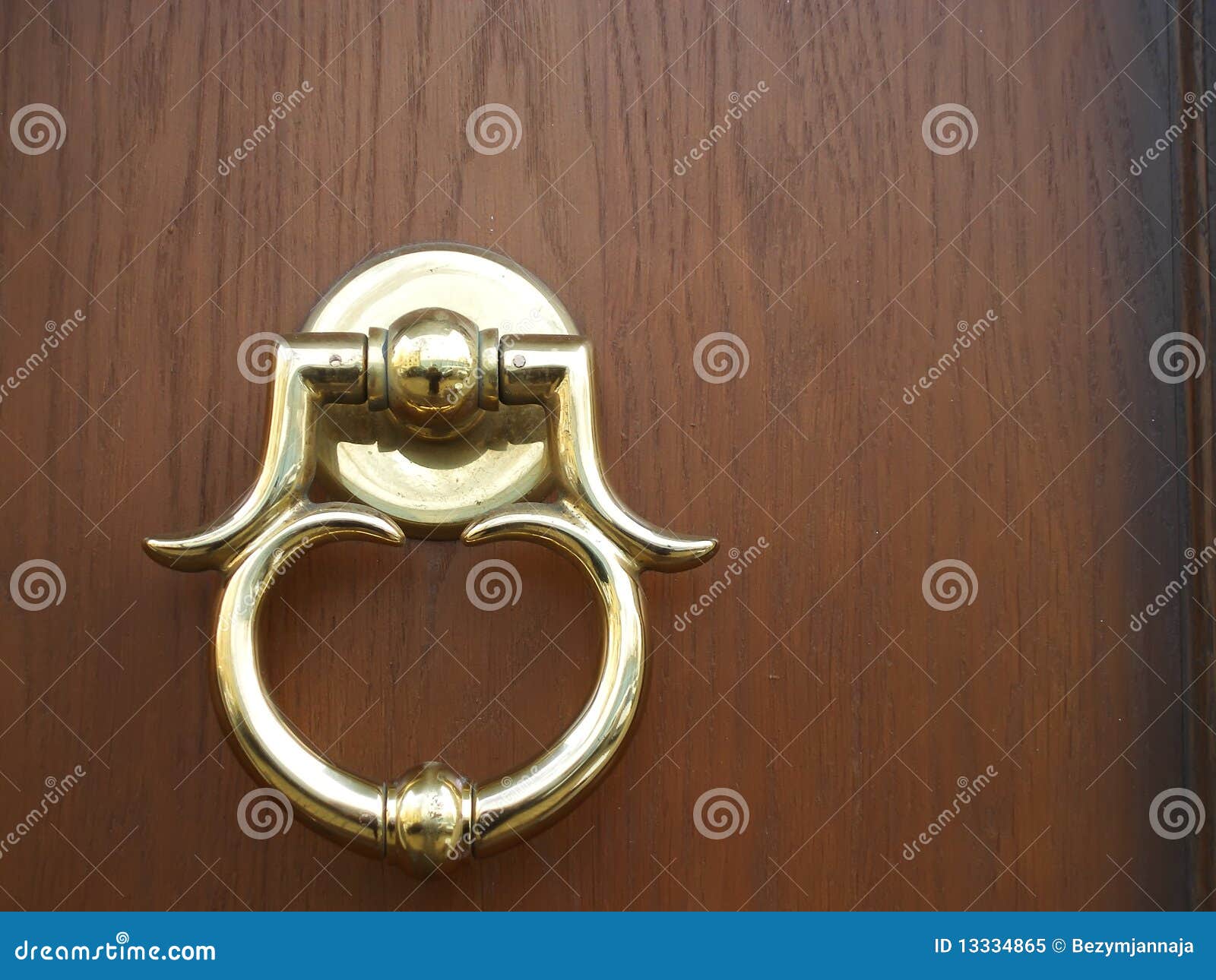 New Golden Door-handle on Wood Background Stock Image - Image of base ...