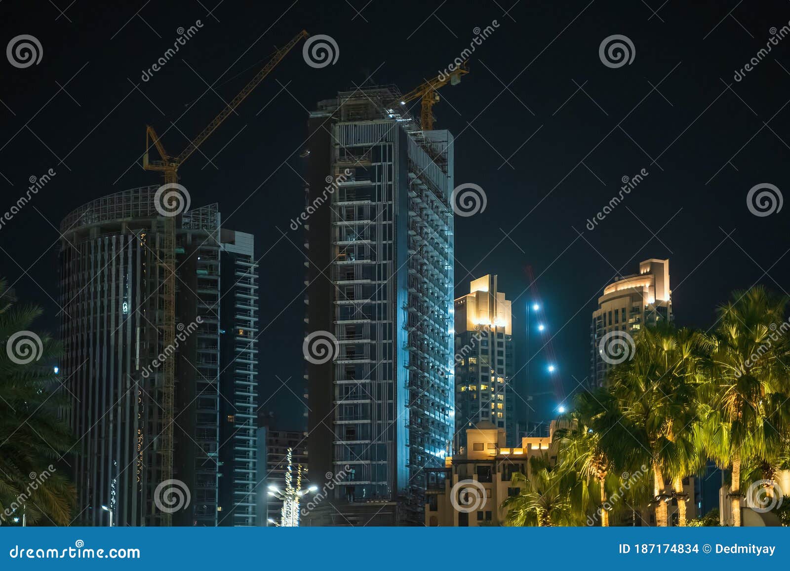 New High Rise Building Construction Site in Dubai at Night. Fast Dubai ...