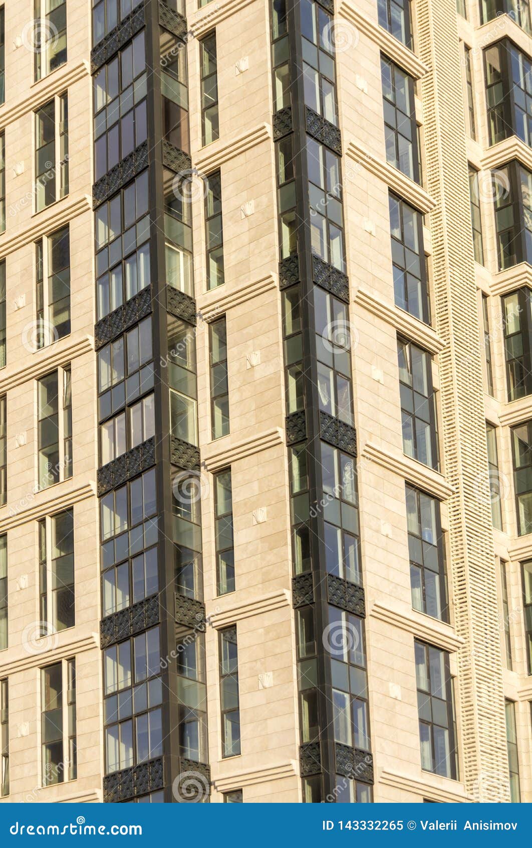 New High-rise Building Decorated with Stone Slabs with Large Windows ...