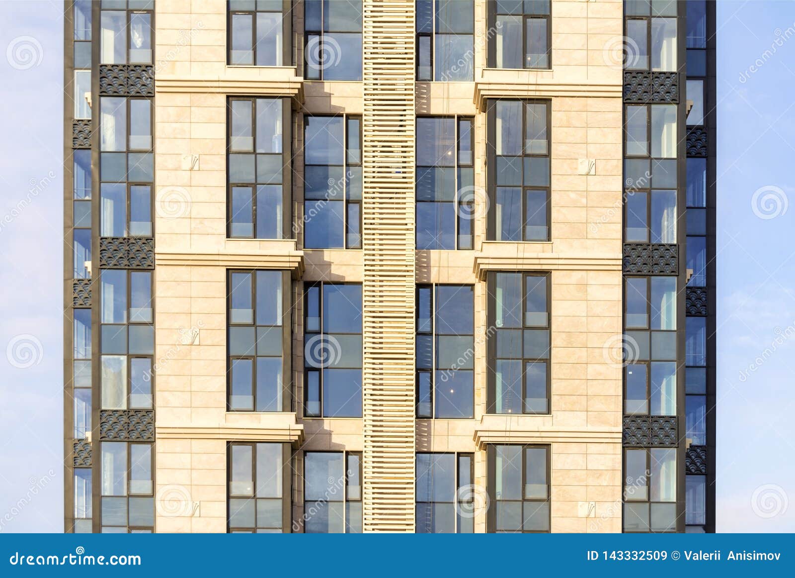 New High-rise Building Decorated with Stone Slabs with Large Windows ...