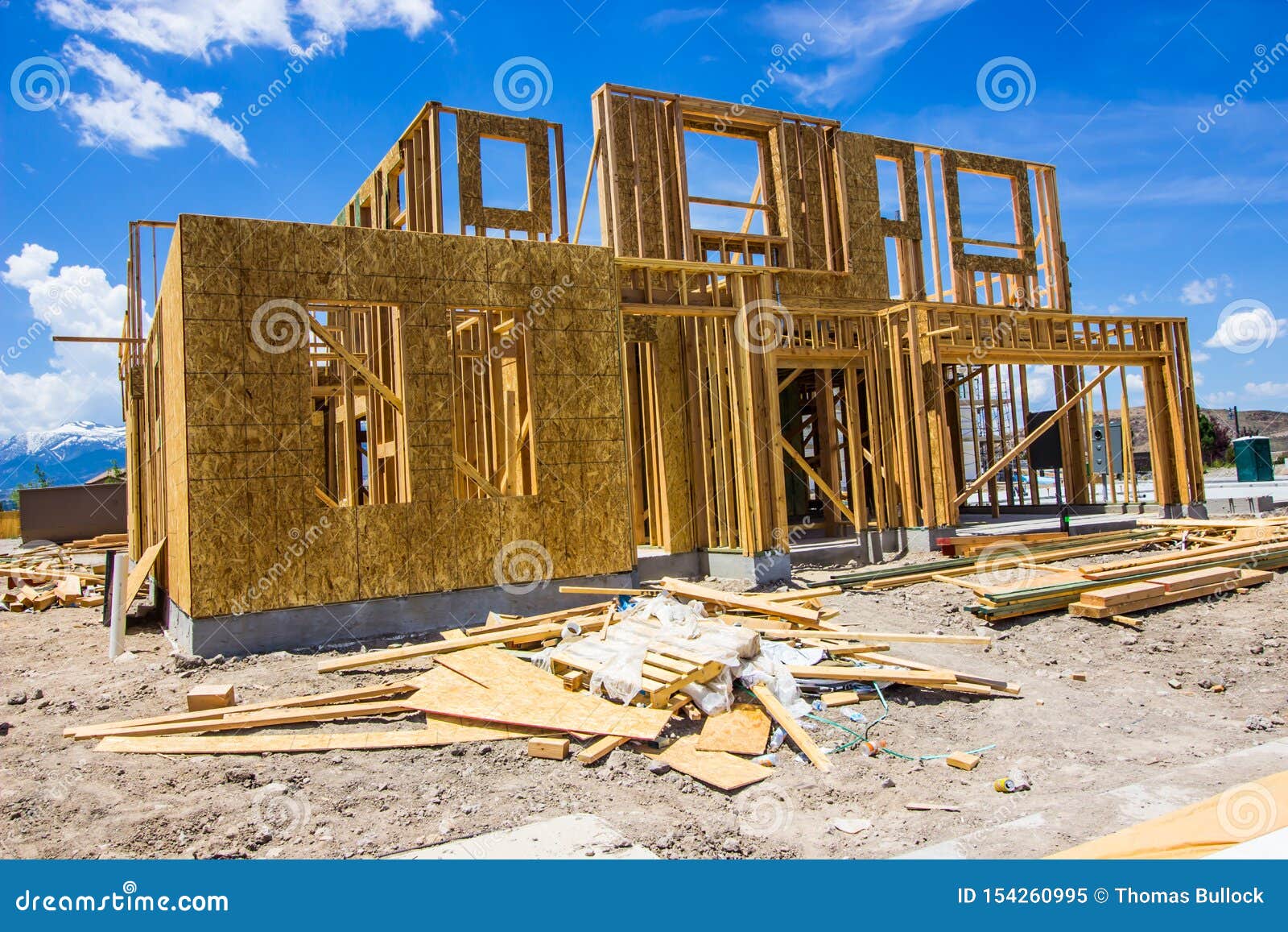 New Home Construction in Framing Stage Stock Image - Image of blue ...