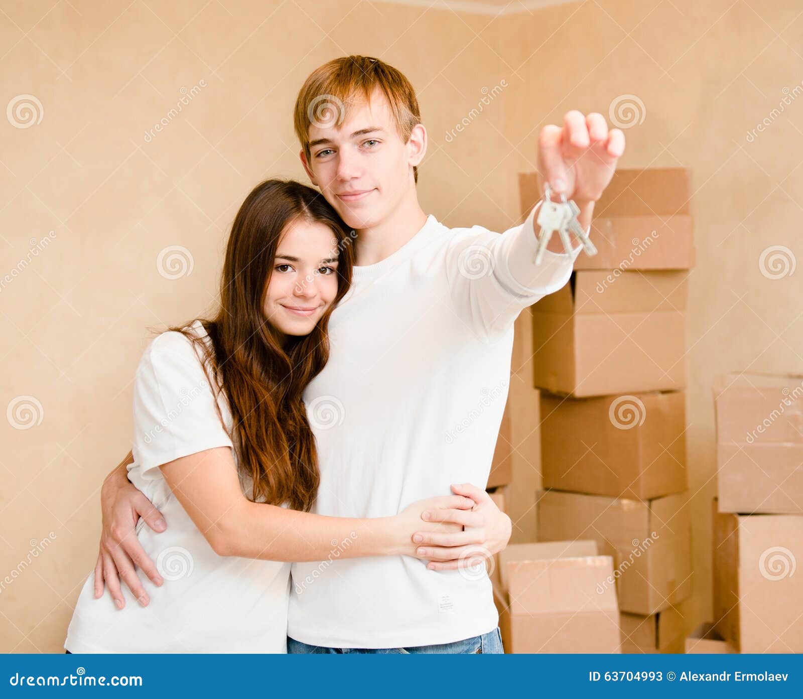New home owners with key stock image. Image of mortgage - 63704993