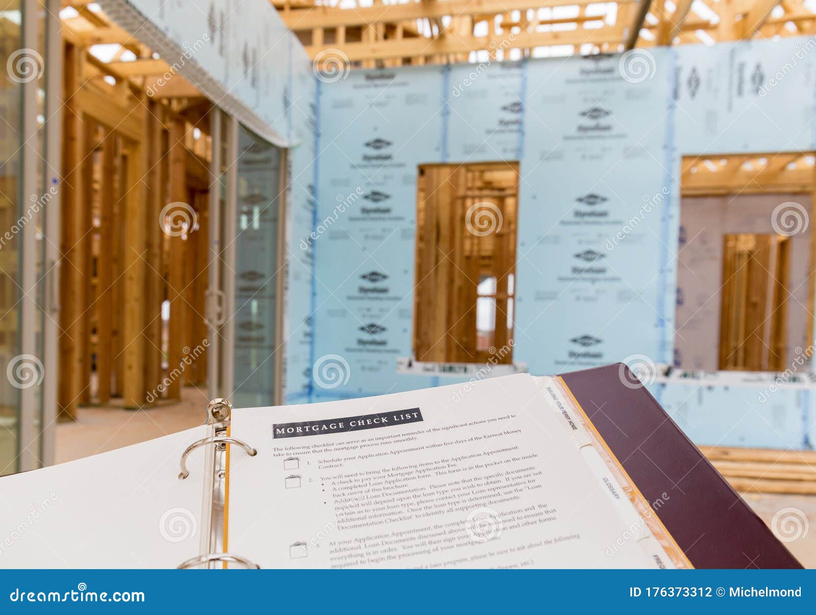 A New House Under Construction and New Home Closing Documents Folder ...