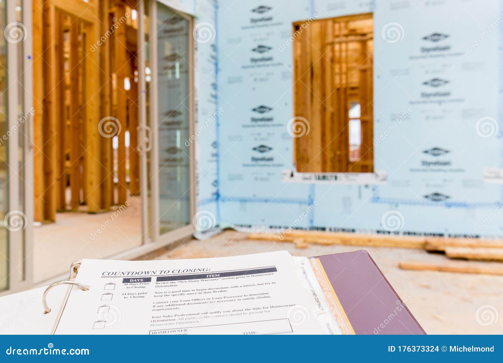 A New House Under Construction and New Home Closing Documents Folder ...