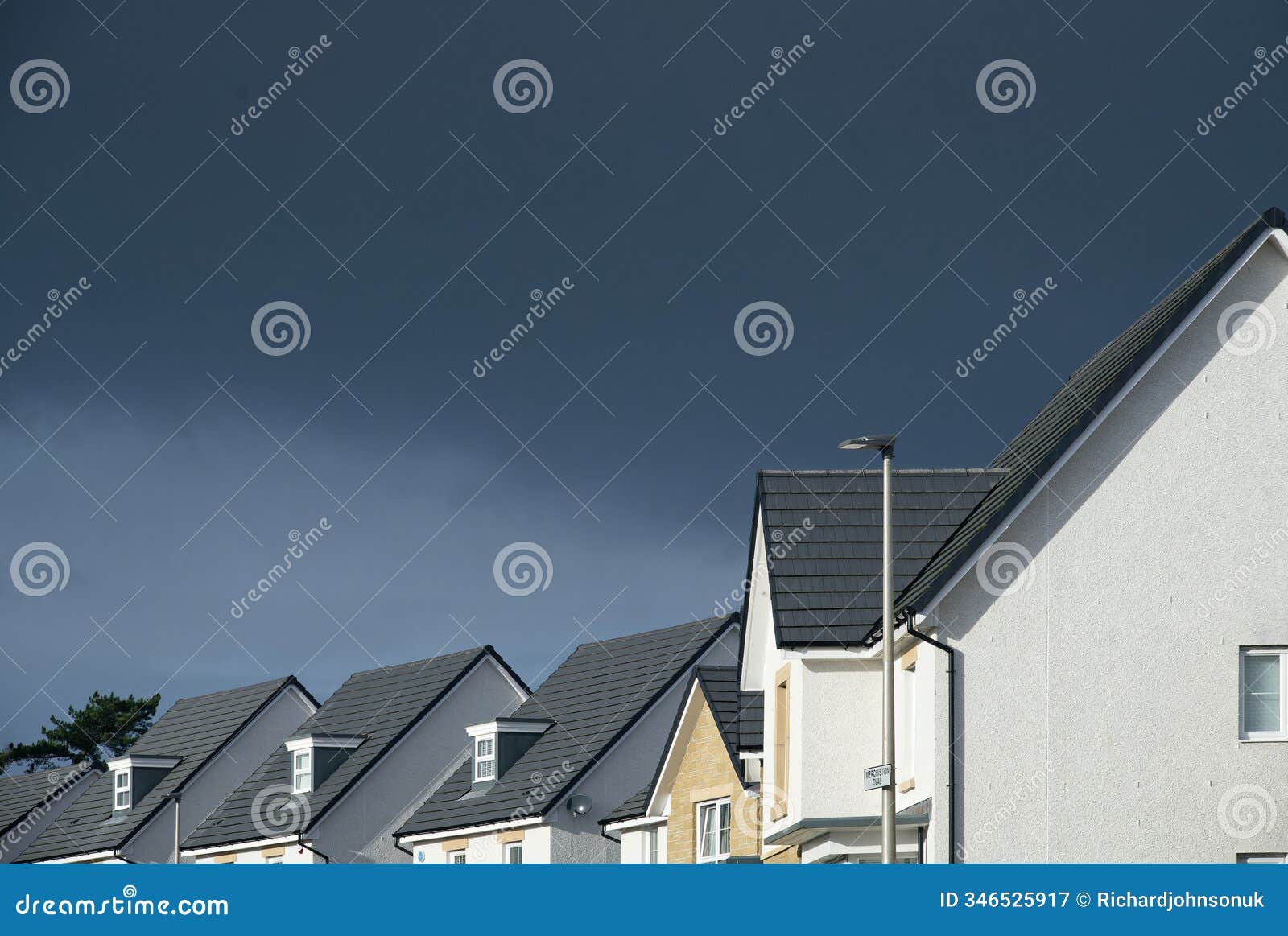 New Housing Development Under Dark Storm Clouds Stock Image - Image of ...