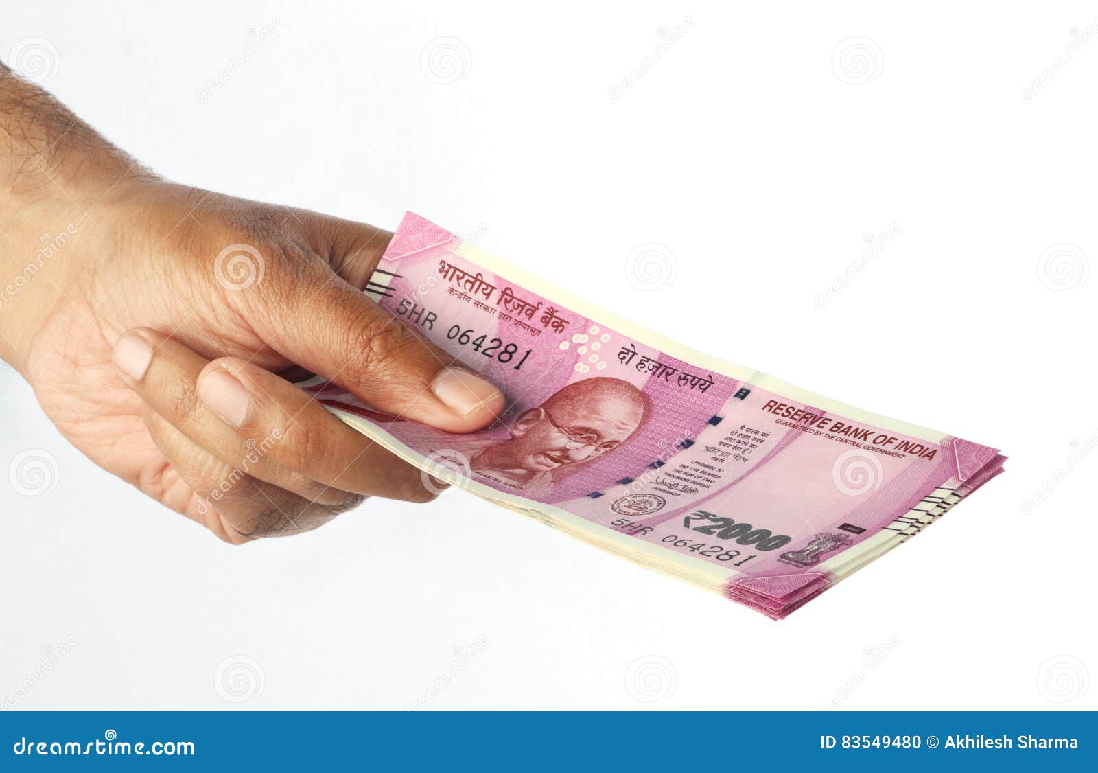 New Indian Rupee 2000 Currency Note in a Hand on White Stock Photo ...