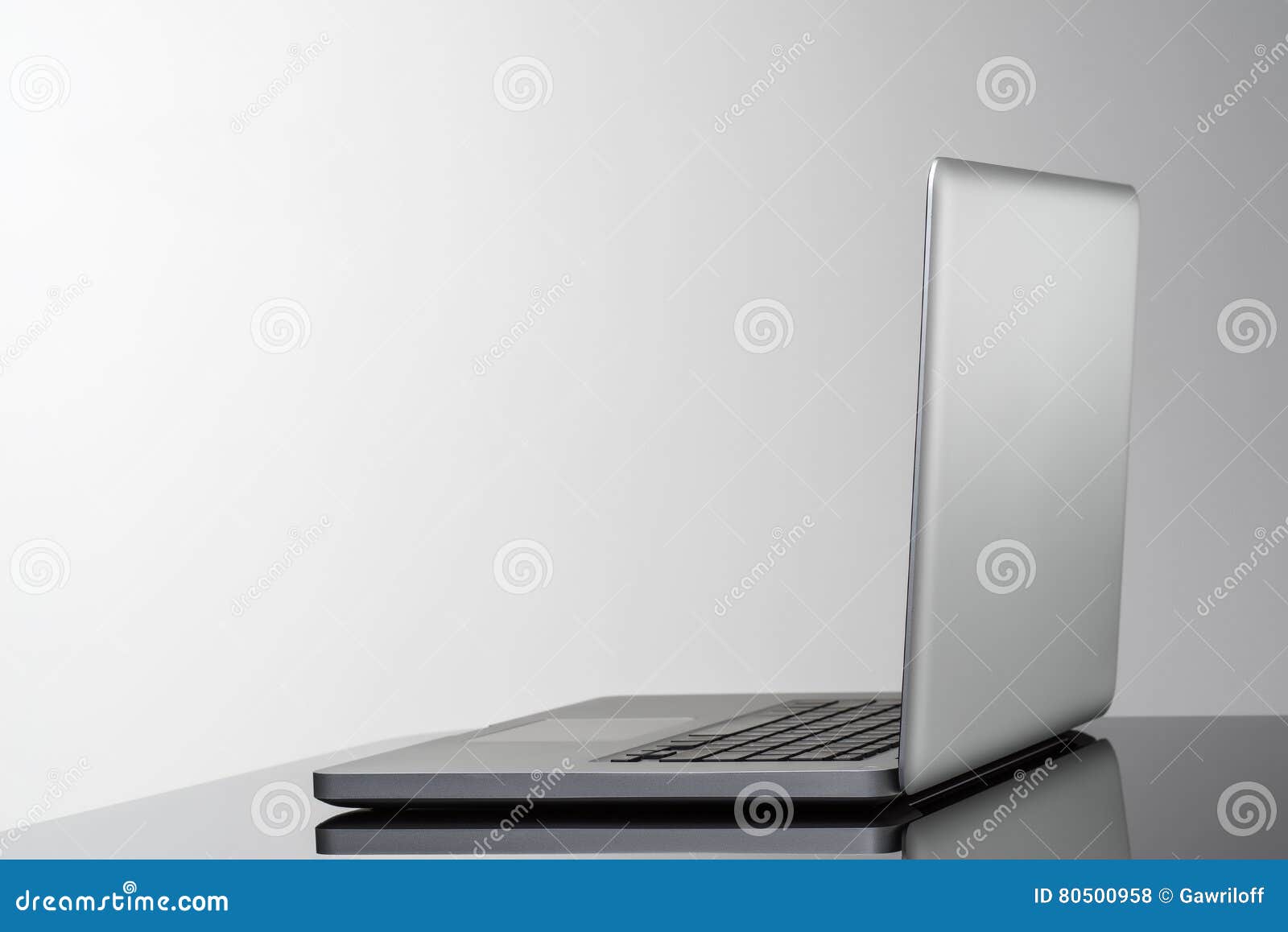 New Laptop Side View with a Popular Design on Table Stock Photo - Image ...