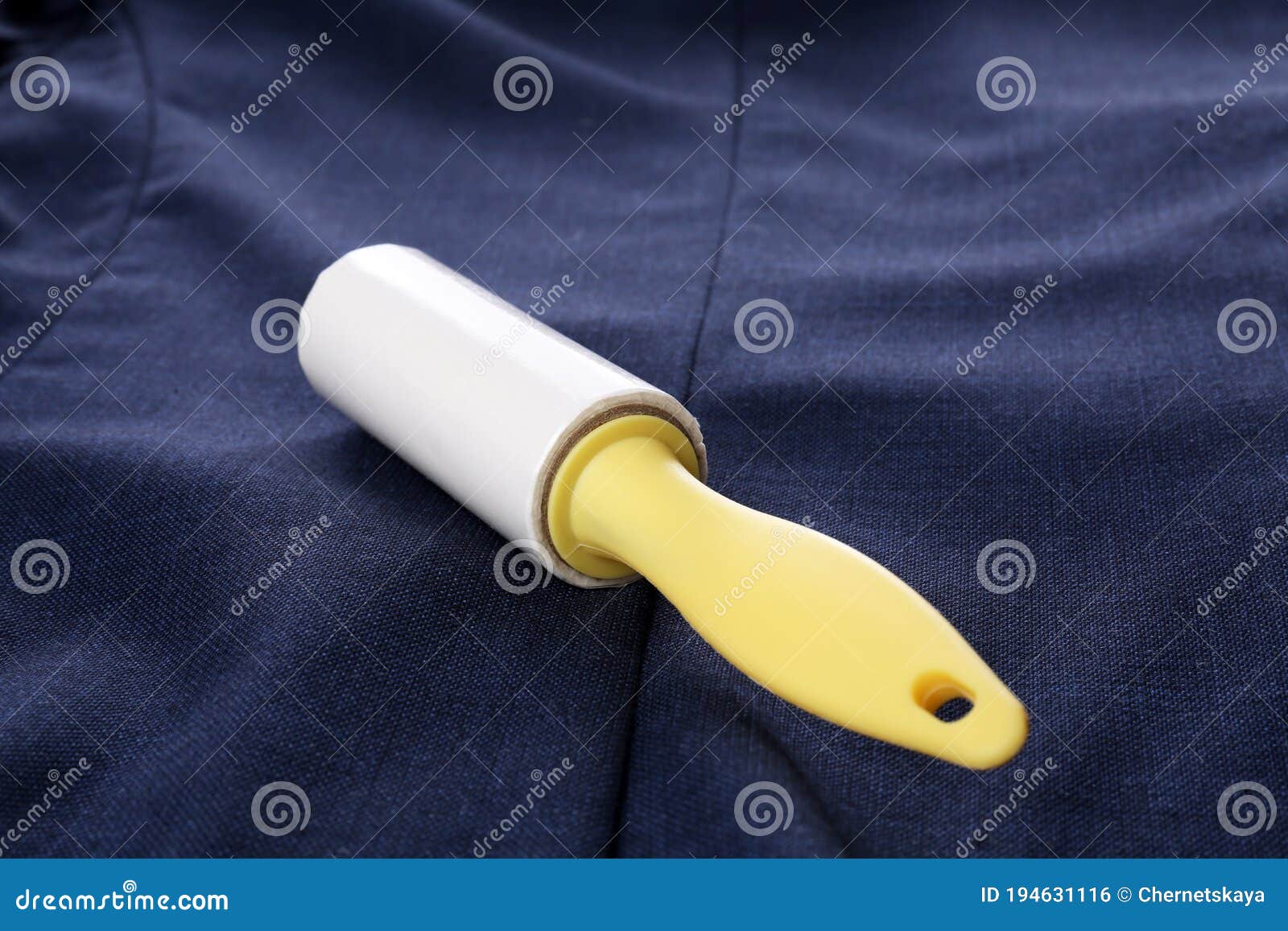 New Lint Roller with Yellow Handle on Jacket Stock Photo - Image of ...