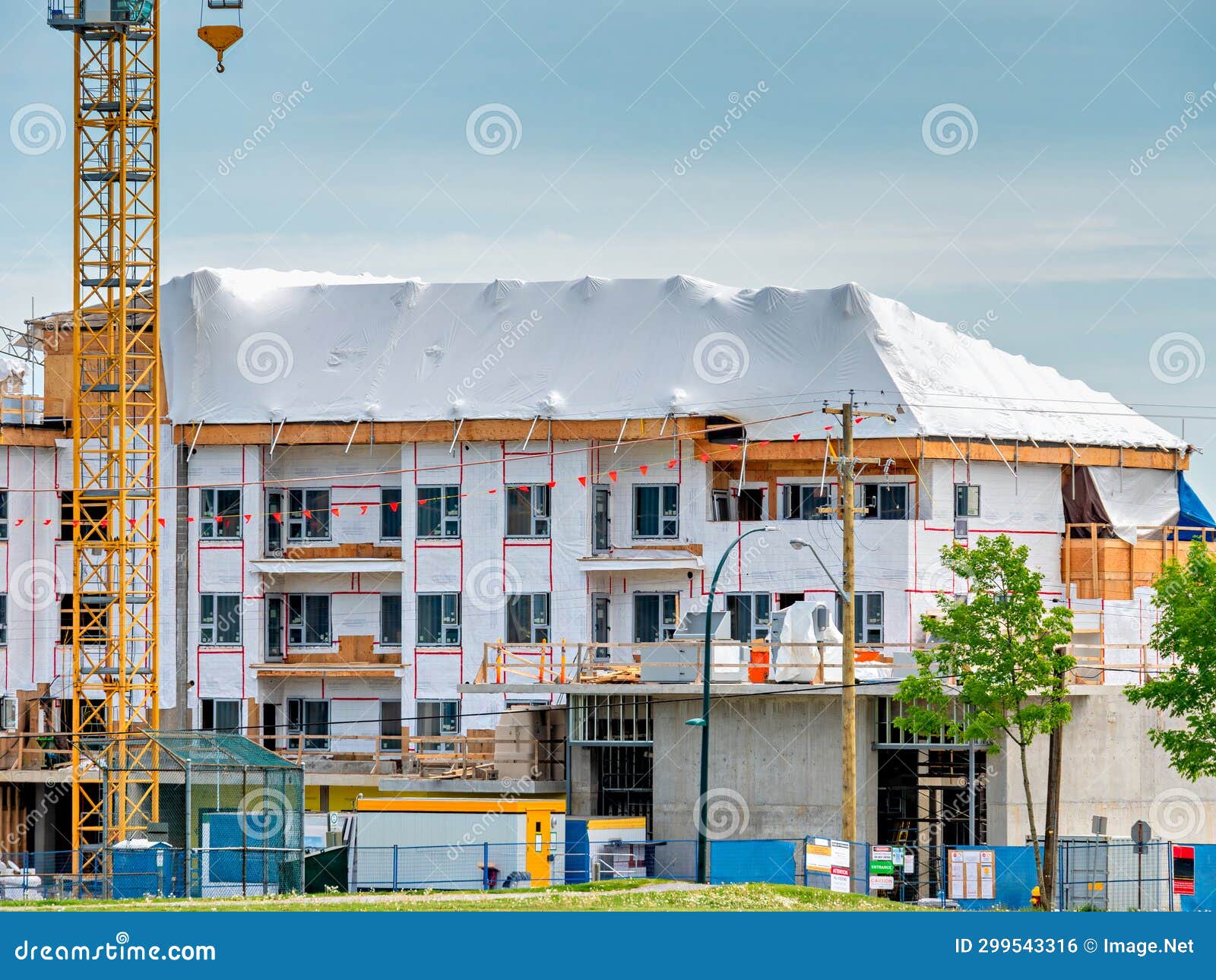 New Low-rise Residential Building Under Construction on Blue Sky ...
