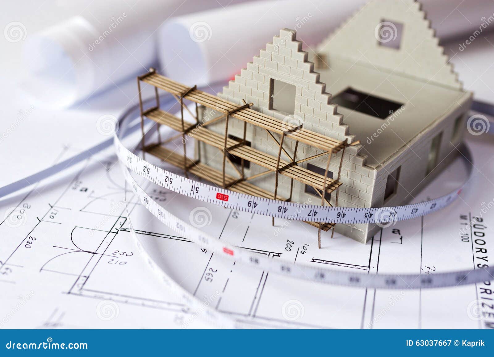 New Model House with Scaffolding on Architecture Blueprint Plan Stock ...