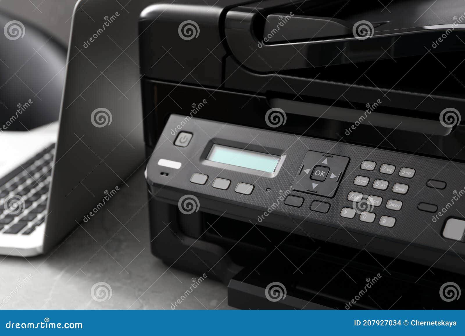 New Modern Printer and Laptop on Grey Table, Closeup Stock Photo ...