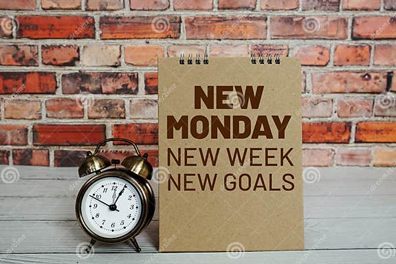 New Monday New Week New Goals Text Message with Alarm Clock on Wooden ...
