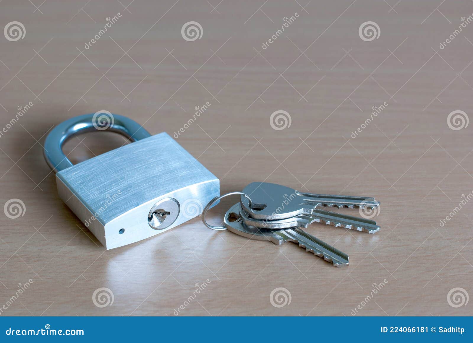 New Padlock with Keys Isolated on a Wooden Table. Stock Image - Image ...