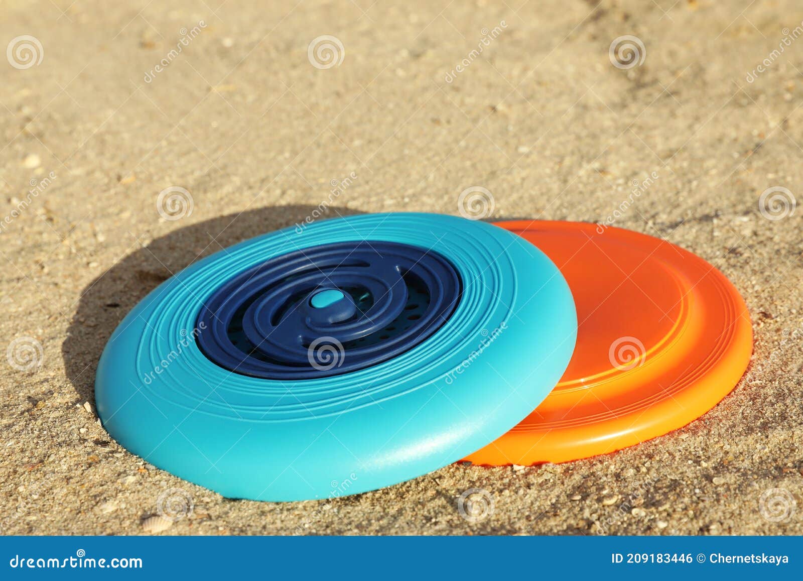 New Plastic Frisbee Discs on Sandy Beach Stock Photo - Image of ...