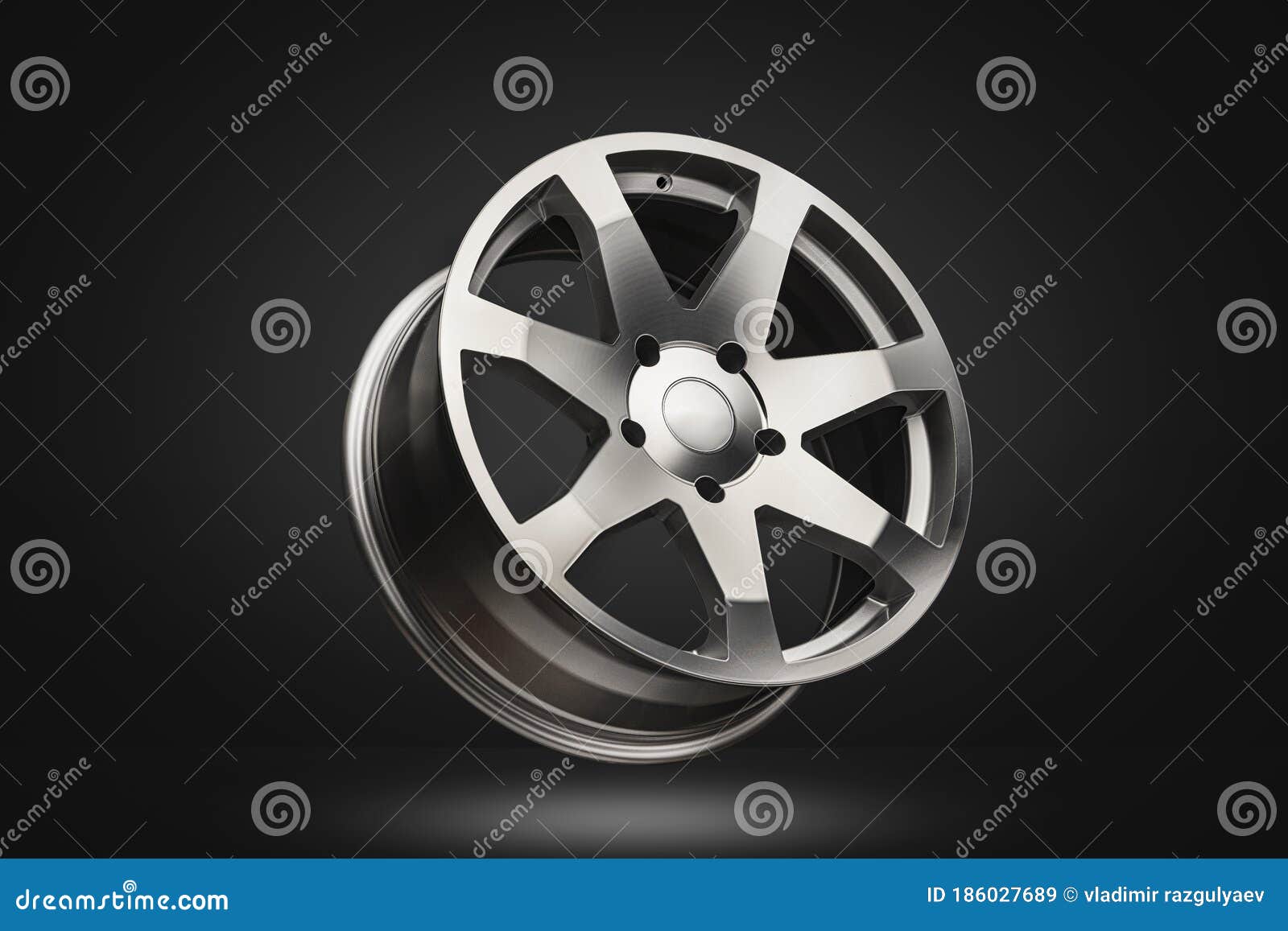 New Polished Silver Alloy Wheel on Dark Gradient Background. Modern ...