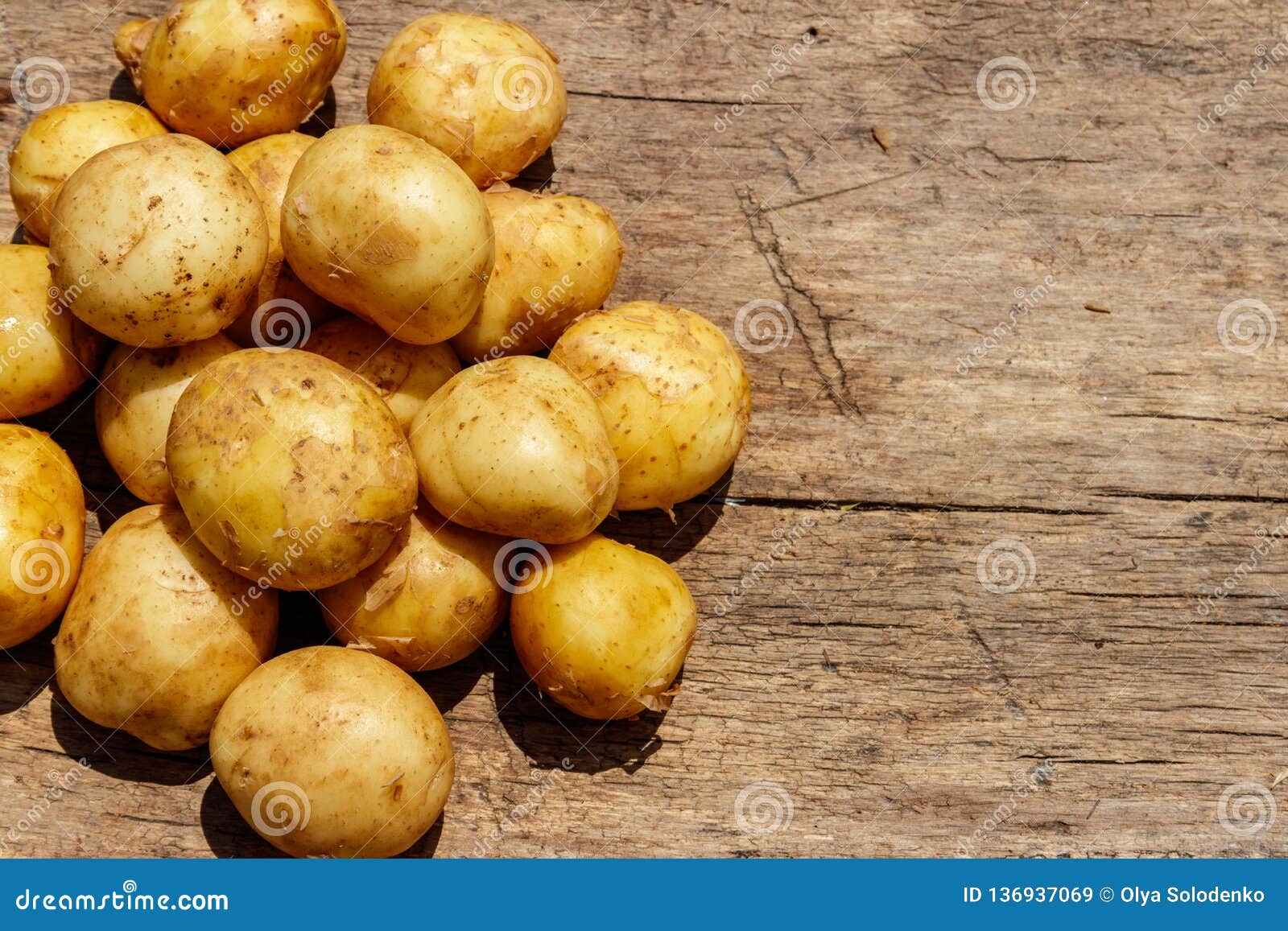 New Potatoes on Rustic Wooden Table Stock Image - Image of closeup ...