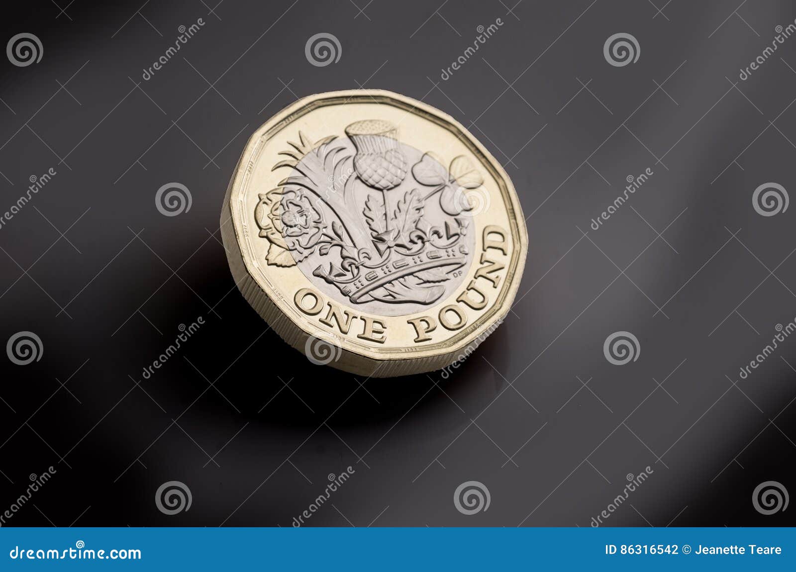 New Pound Coin on Dark Background Editorial Photography - Image of ...