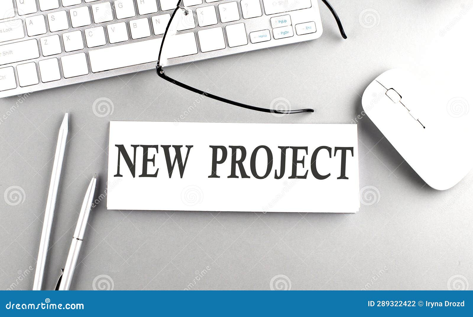 NEW PROJECT Written on Paper with Office Tools and Keyboard on the Grey ...