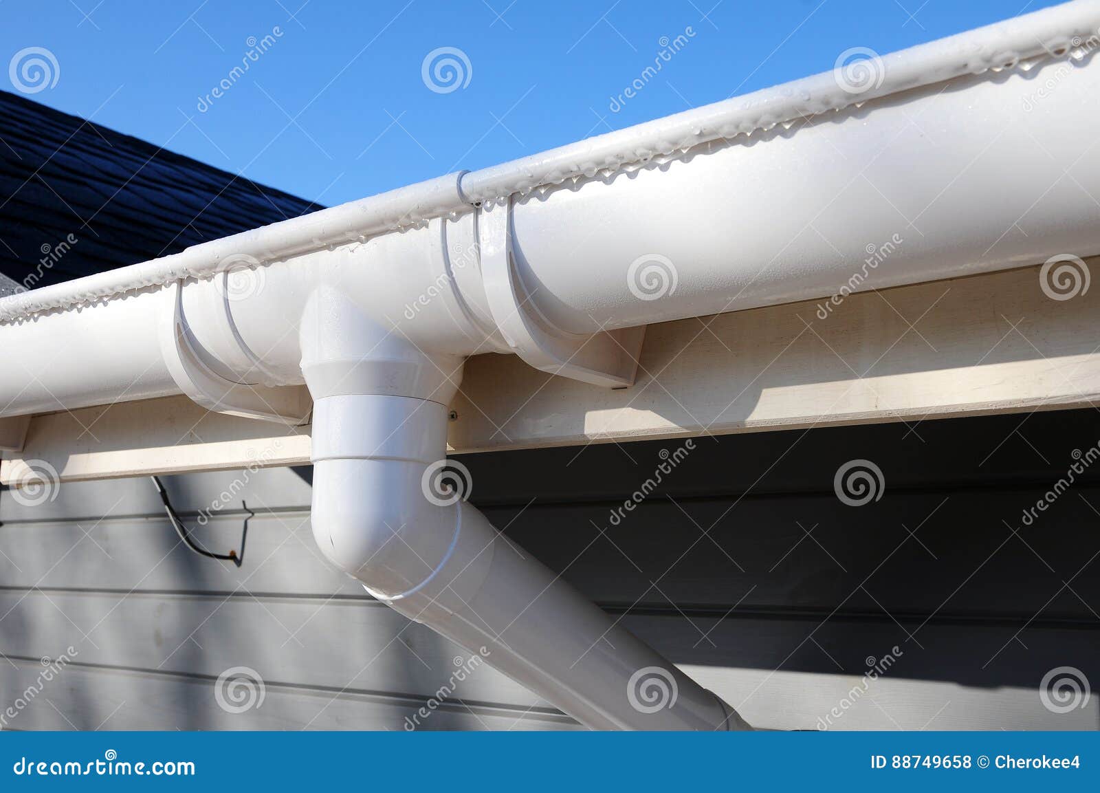 New Rain Gutter on a Home Against Blue Sky. Stock Photo - Image of ...