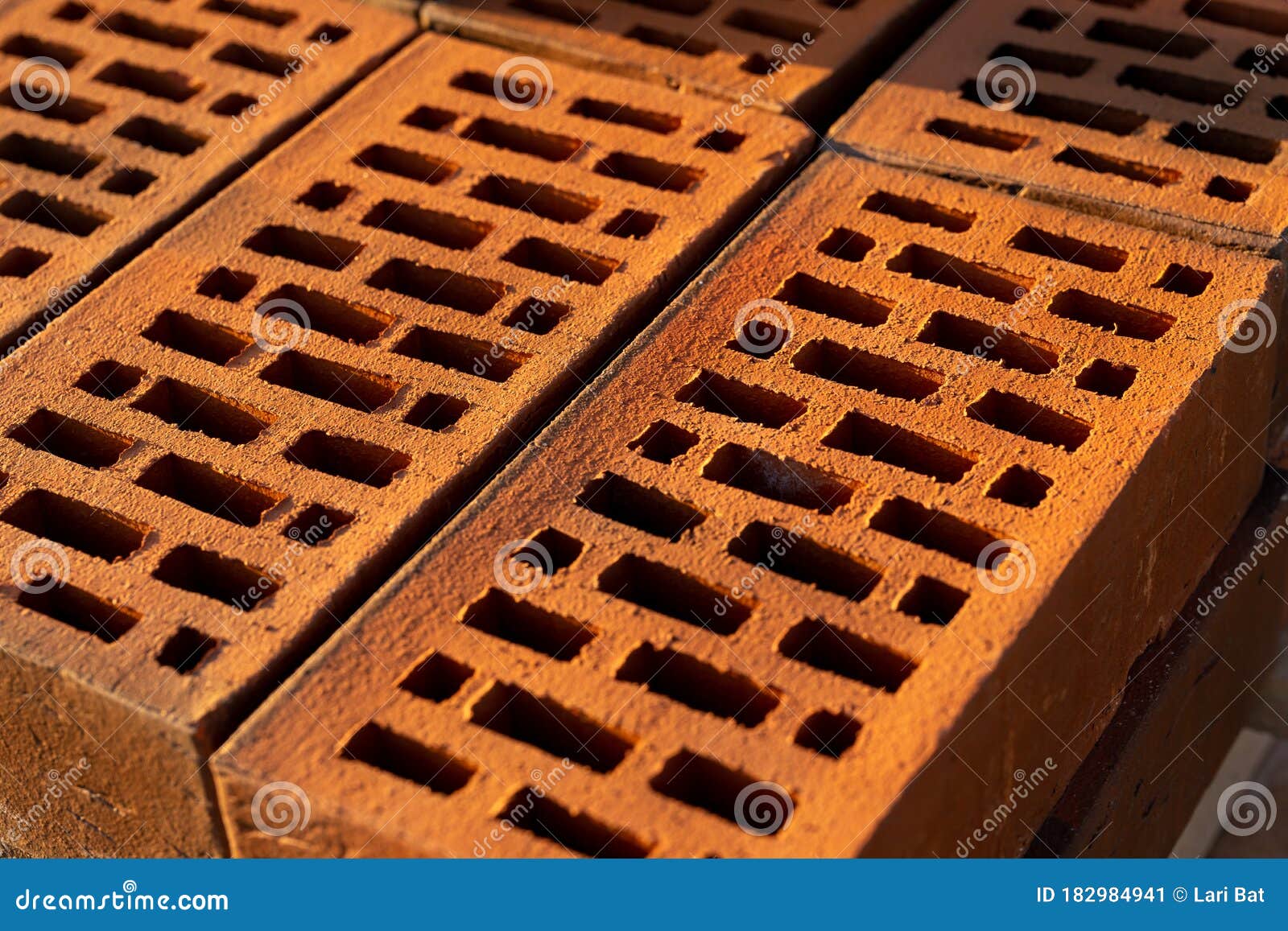 New Red Hollow Bricks at a Construction Site at Sunset. Rows of Trim ...