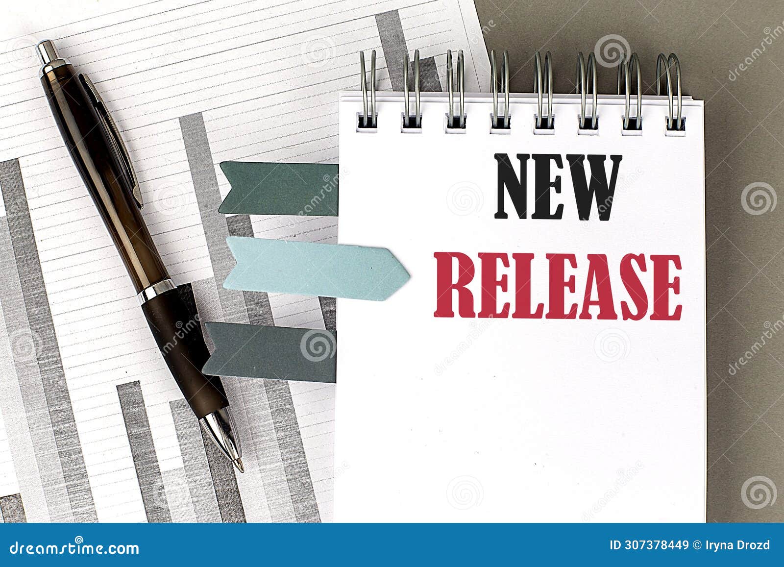 NEW RELEASE Text on Notebook with Pen, Calculator and Chart on a Grey ...