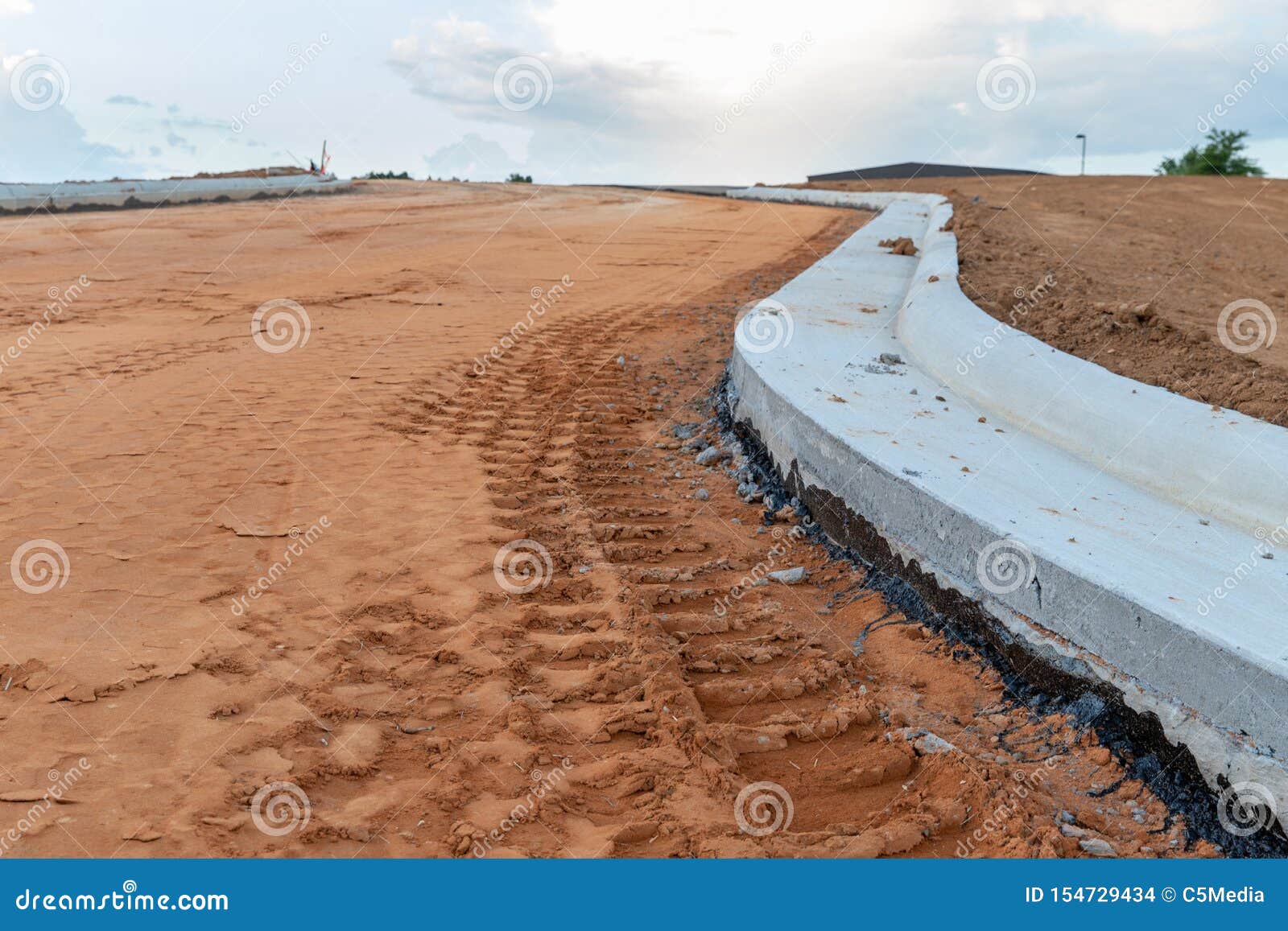 New Road Under Construction with Concrete Curb Stock Photo - Image of ...