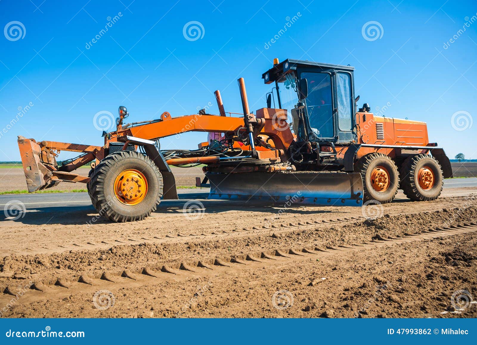 New Roadworking Tractor Standing on Edge of Road Stock Photo - Image of ...