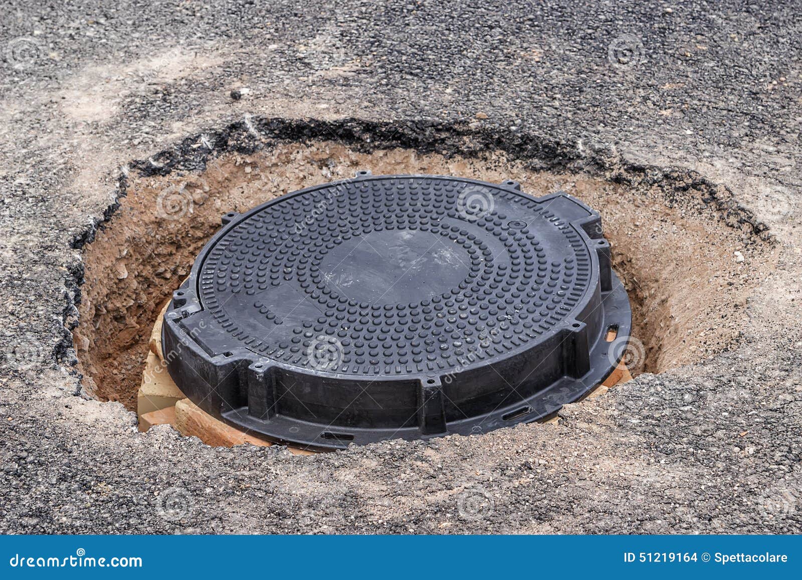 New Round Iron Manhole Cover on the Road Stock Photo - Image of road ...