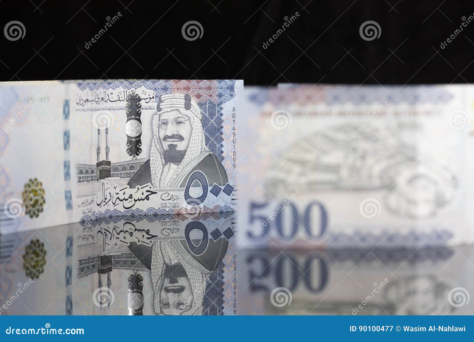 New Saudi Riyal Notes on a Dark Reflective Surface Stock Image - Image ...
