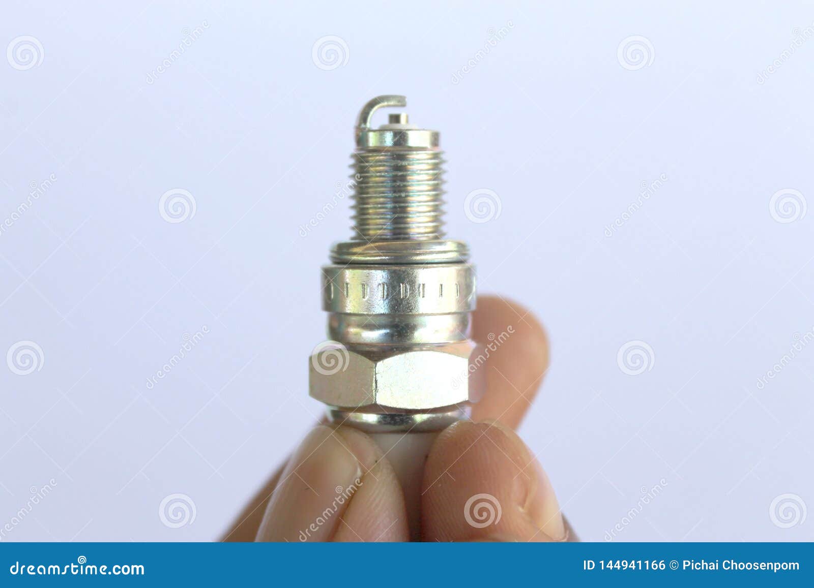 New Spark Plug in Hand before Use Stock Photo - Image of holds ...