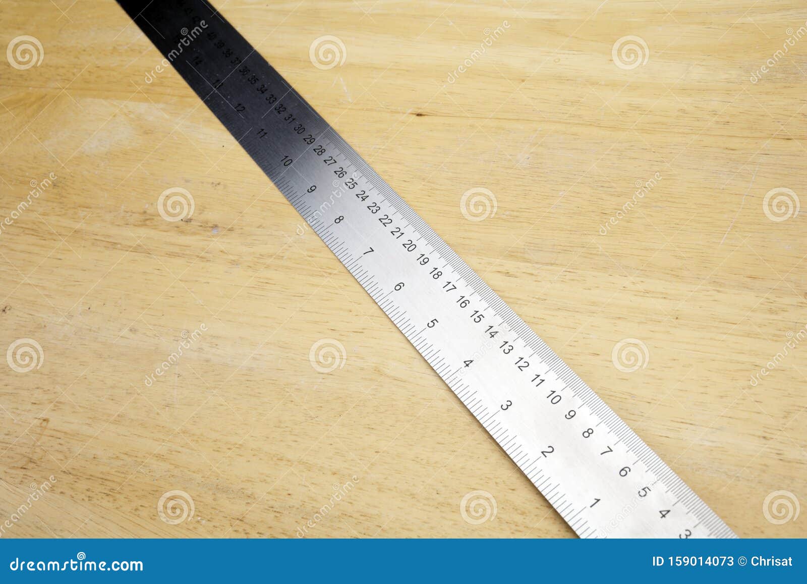 A new steel rule on wood stock image. Image of construction - 159014073