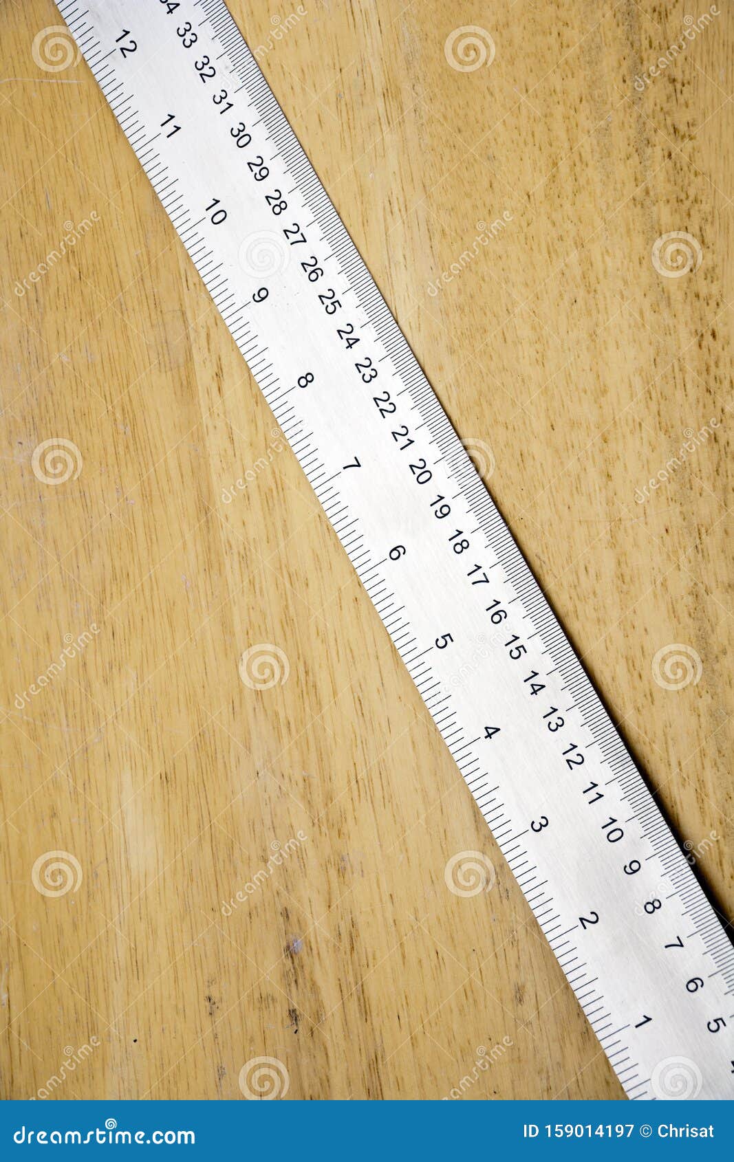 A new steel rule on wood stock image. Image of space - 159014197