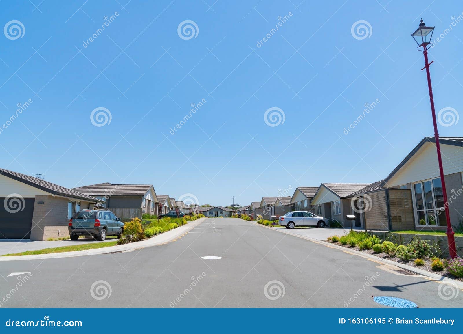 New Subdivision Street with Uniform Homes Stock Image - Image of people ...