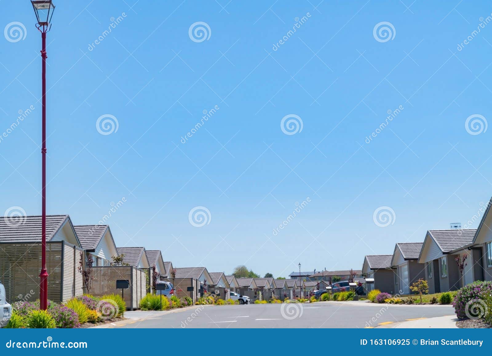 New Subdivision Street with Uniform Homes Stock Image - Image of road ...