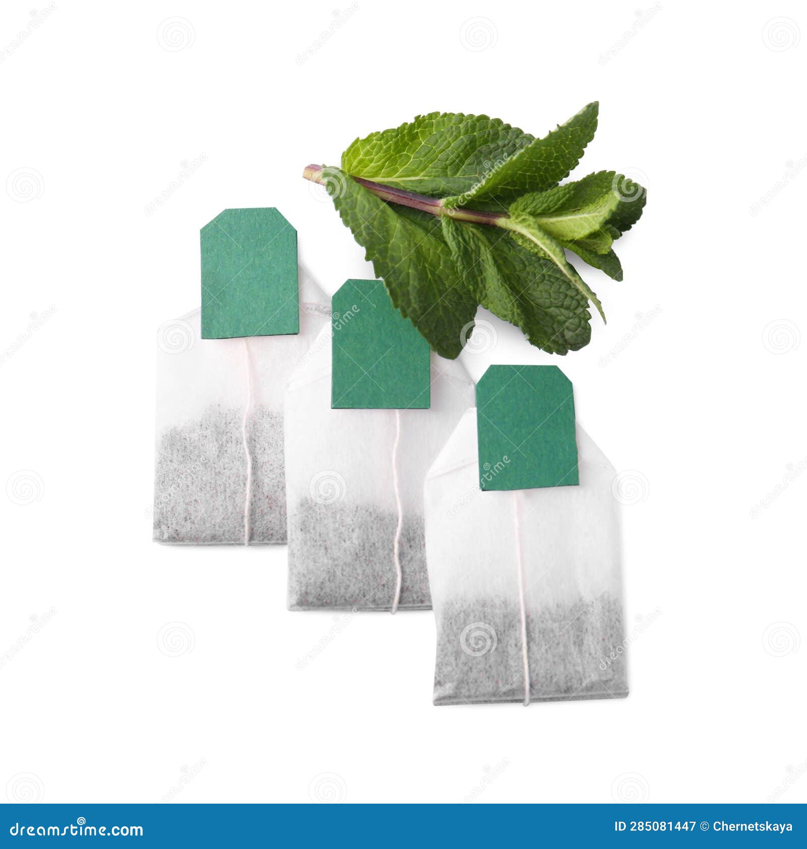 New Tea Bags with Labels and Mint on White Background, Top View Stock ...