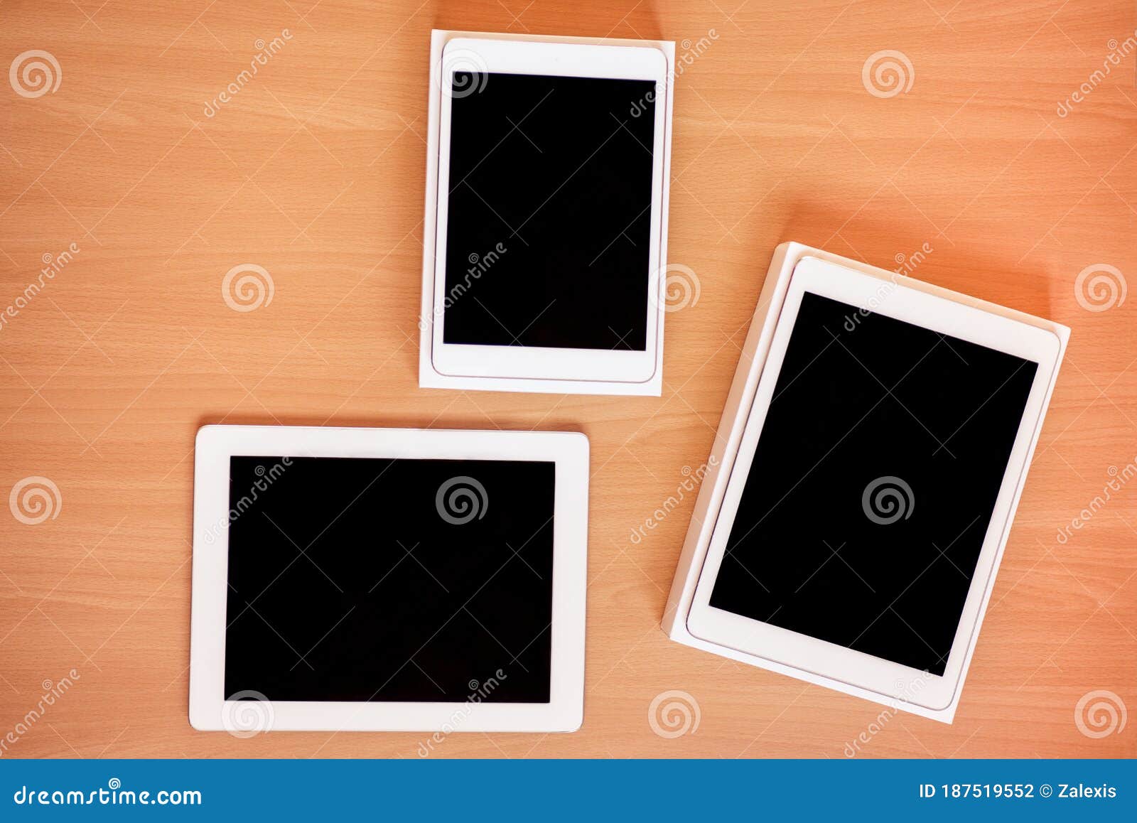 New Technology on Desk: Different Tablet Series, Tablets with Boxes on ...