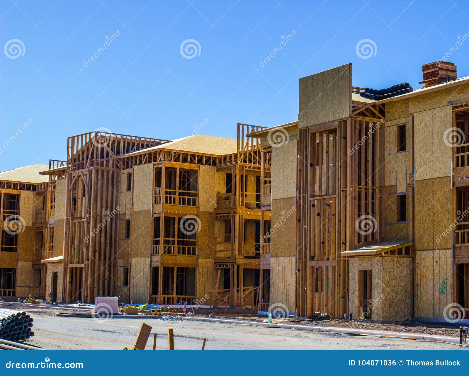 New Three Story Apartment Construction & Framing Stock Photo - Image of ...