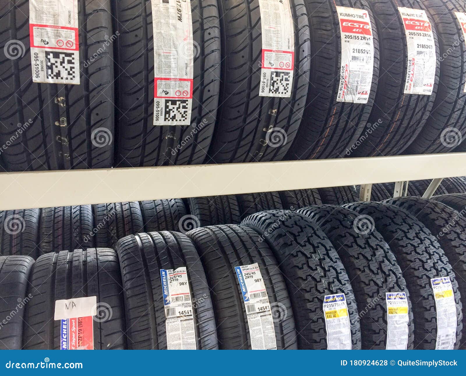 New tires in store editorial stock photo. Image of performance - 180924628