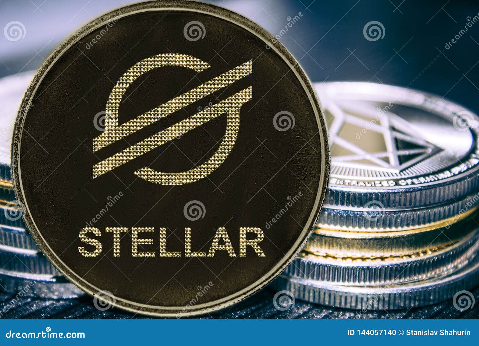 New Token Cryptocurrency Stellar XLM on the Background of a Stack of ...