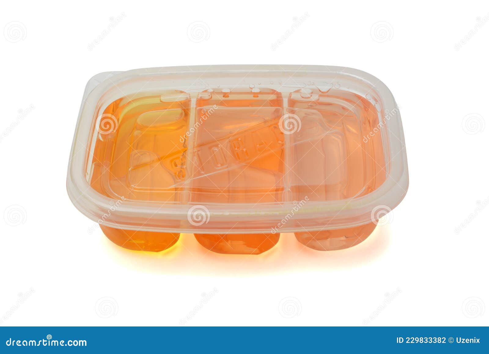 A New Transparent Orange Slime in a Plastic Container. Isolated on a ...