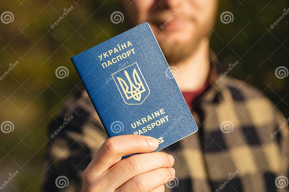 New Ukrainian Blue Biometric Passport With Identification Chip In Hands