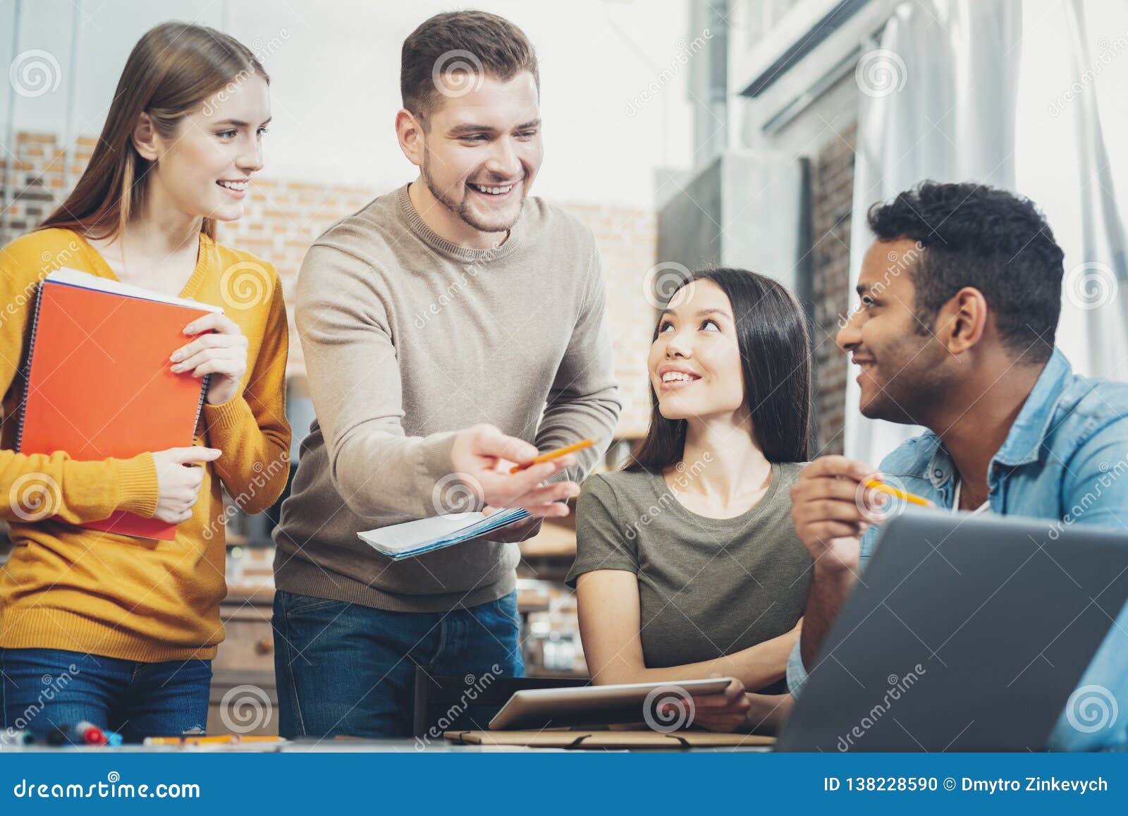 Attractive Four Students Brainstorming Stock Photo - Image of learning ...