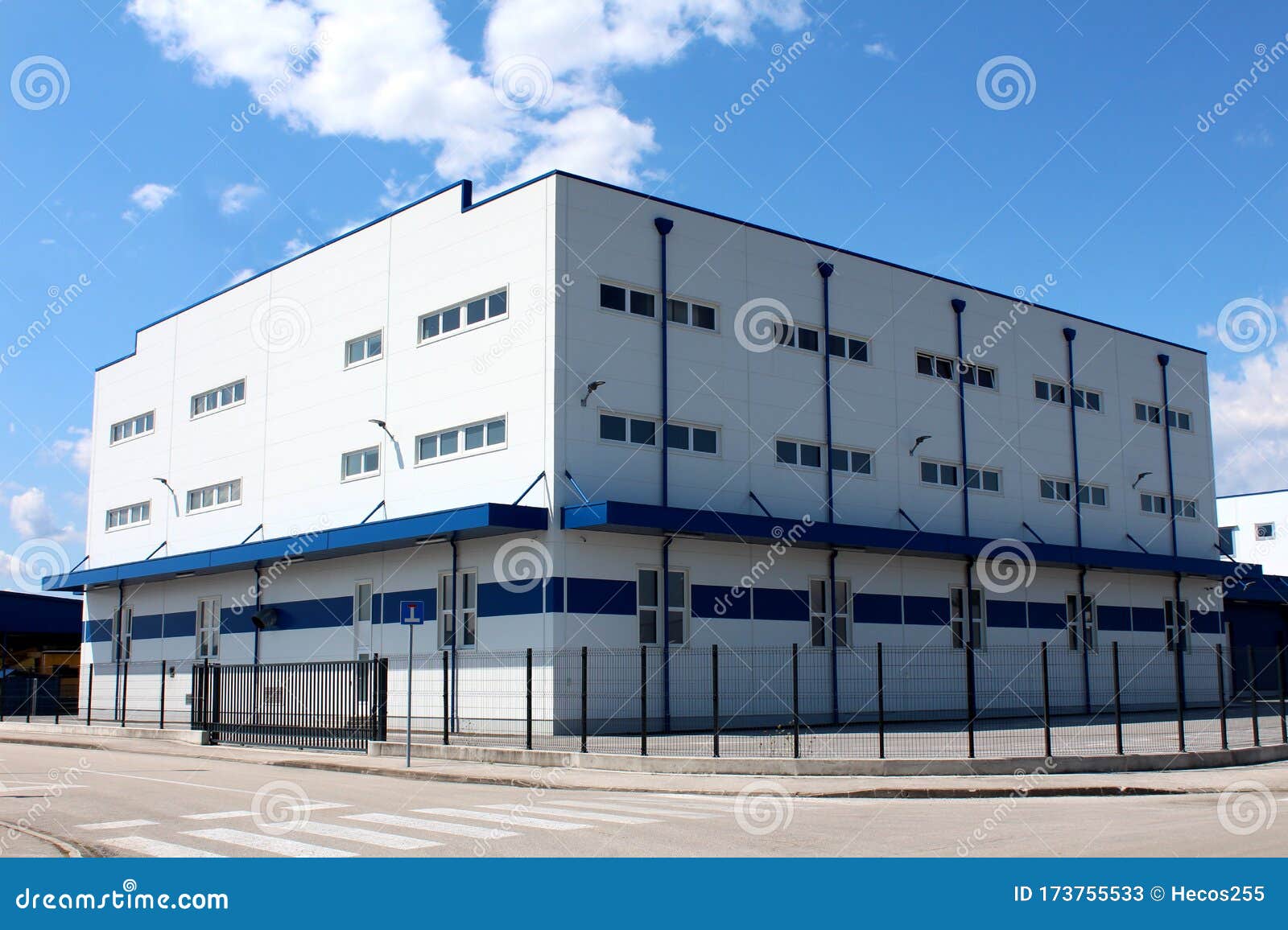 New White and Blue Industrial Building with Lower Storage Area and ...