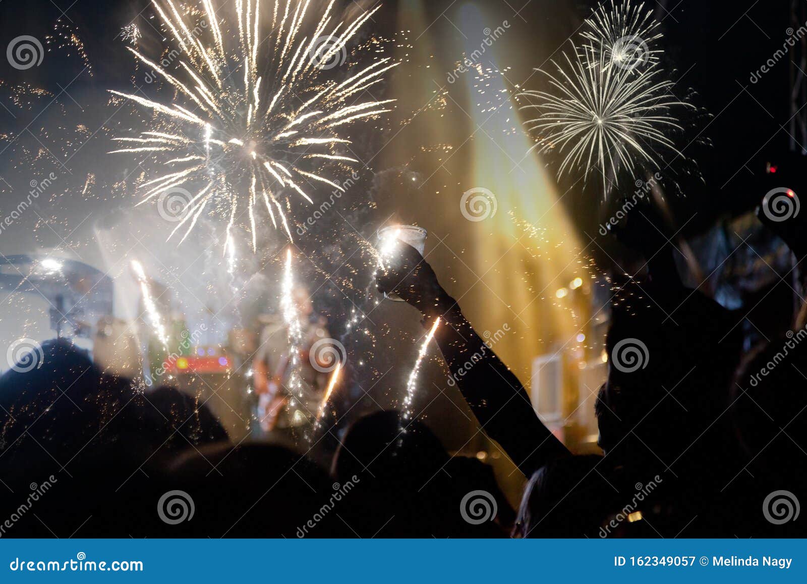 New Year Concept - Cheering Crowd and Fireworks Stock Image - Image of ...