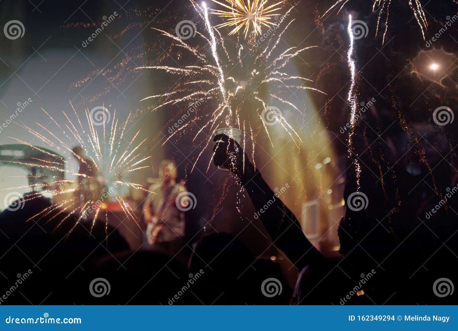 New Year Concept - Cheering Crowd and Fireworks Stock Photo - Image of ...